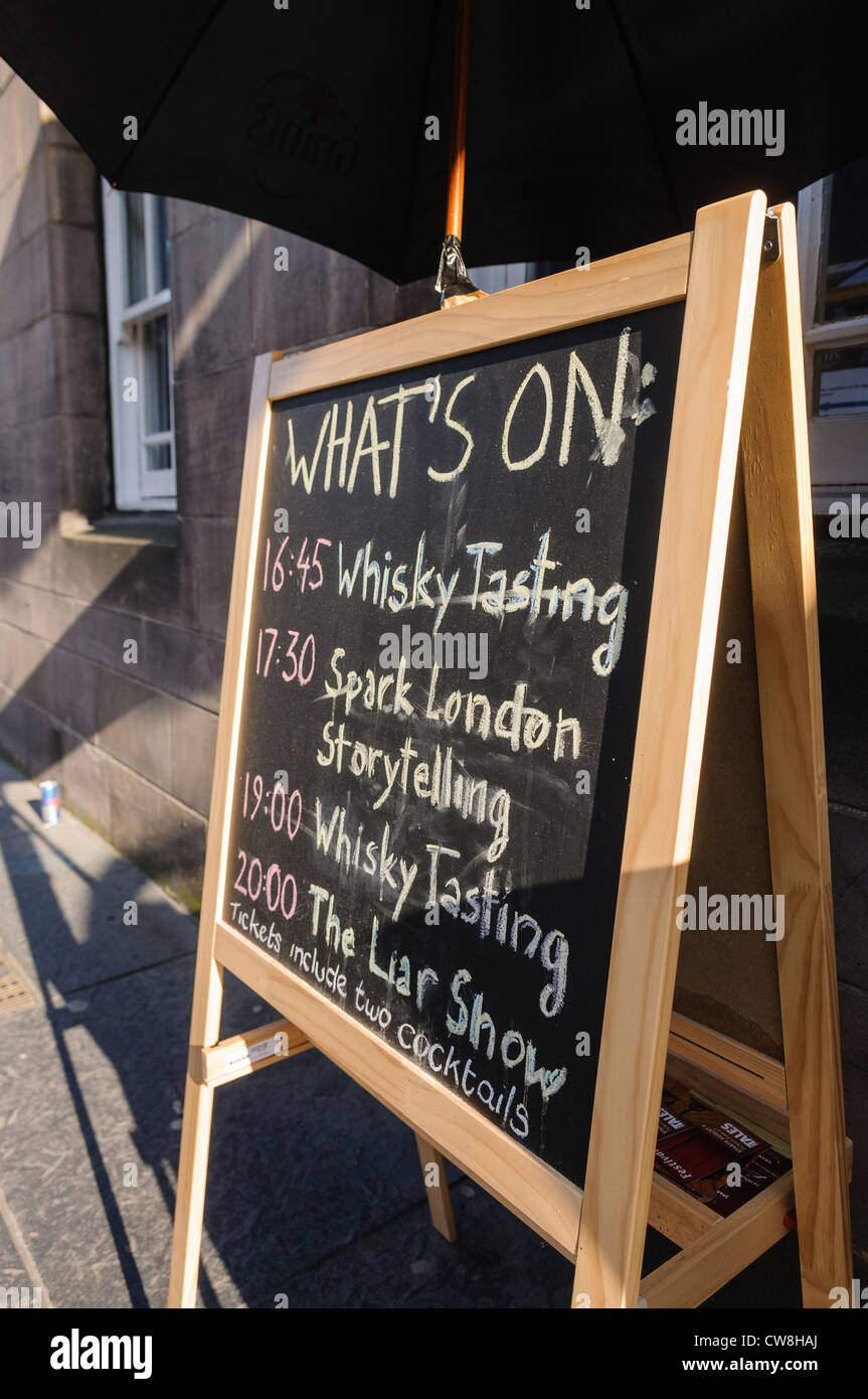 Blackboard outside a pub indicating what events are on in the pub ...