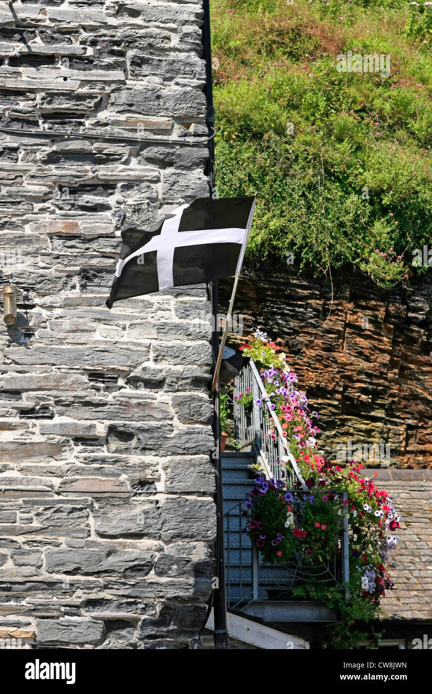 The Cornish flag ffliees proud outside a pub in Cornwall Stock Photo ...