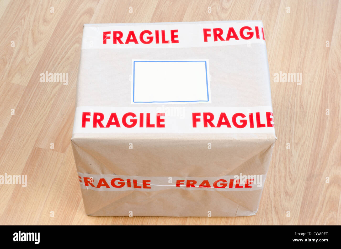 Fragile carton box with a blank shipping label - studio shot Stock ...