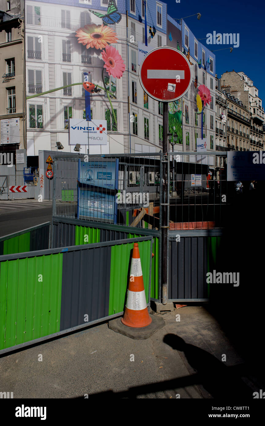 Street roadworks barriers and retail shop hoarding in Rue de Rivoli ...