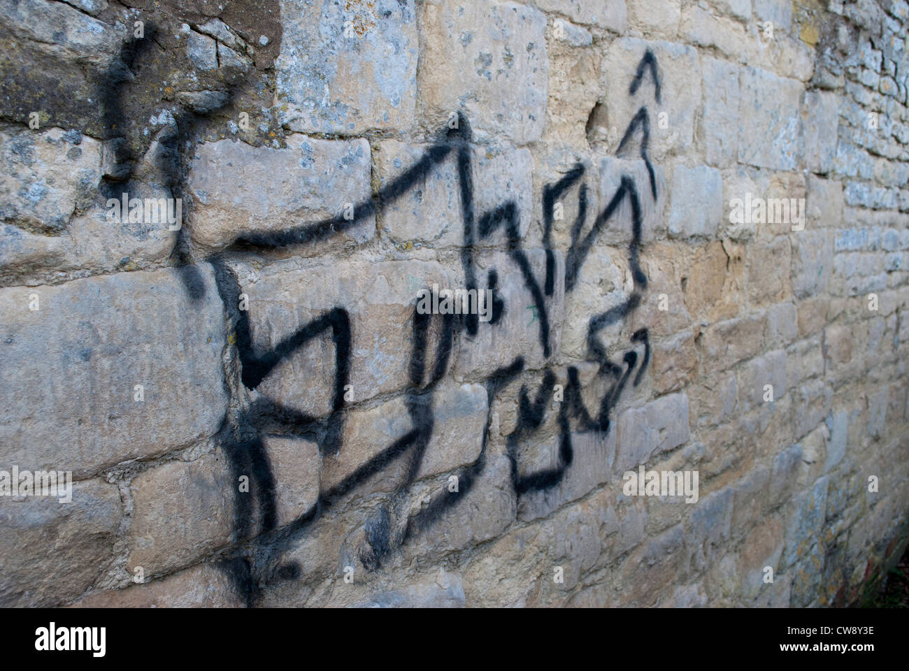 Graffiti tag 'Jax' sprayed onto an old stone Stock Photo - Alamy