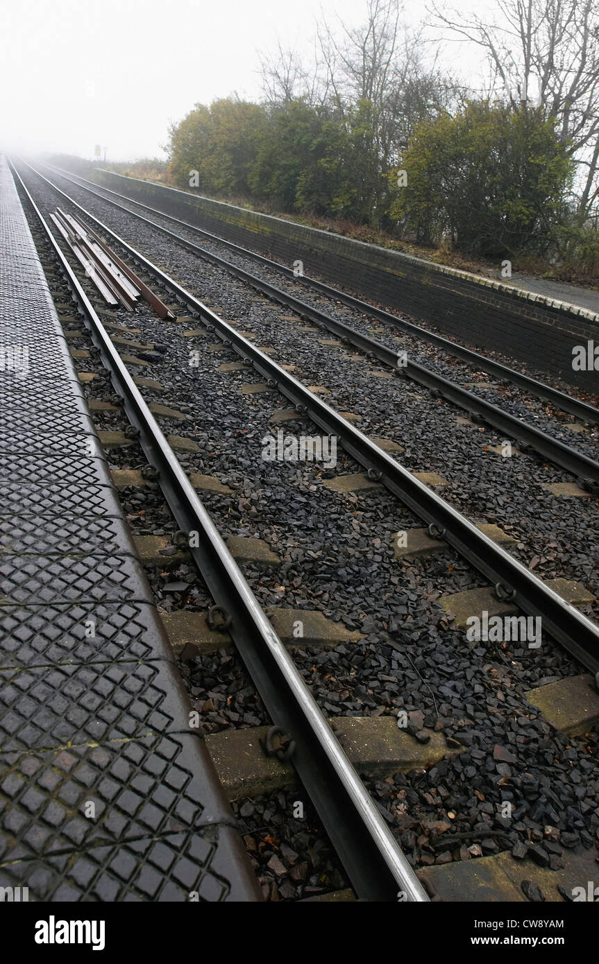 Rail tracks and platform station Stock Photo - Alamy