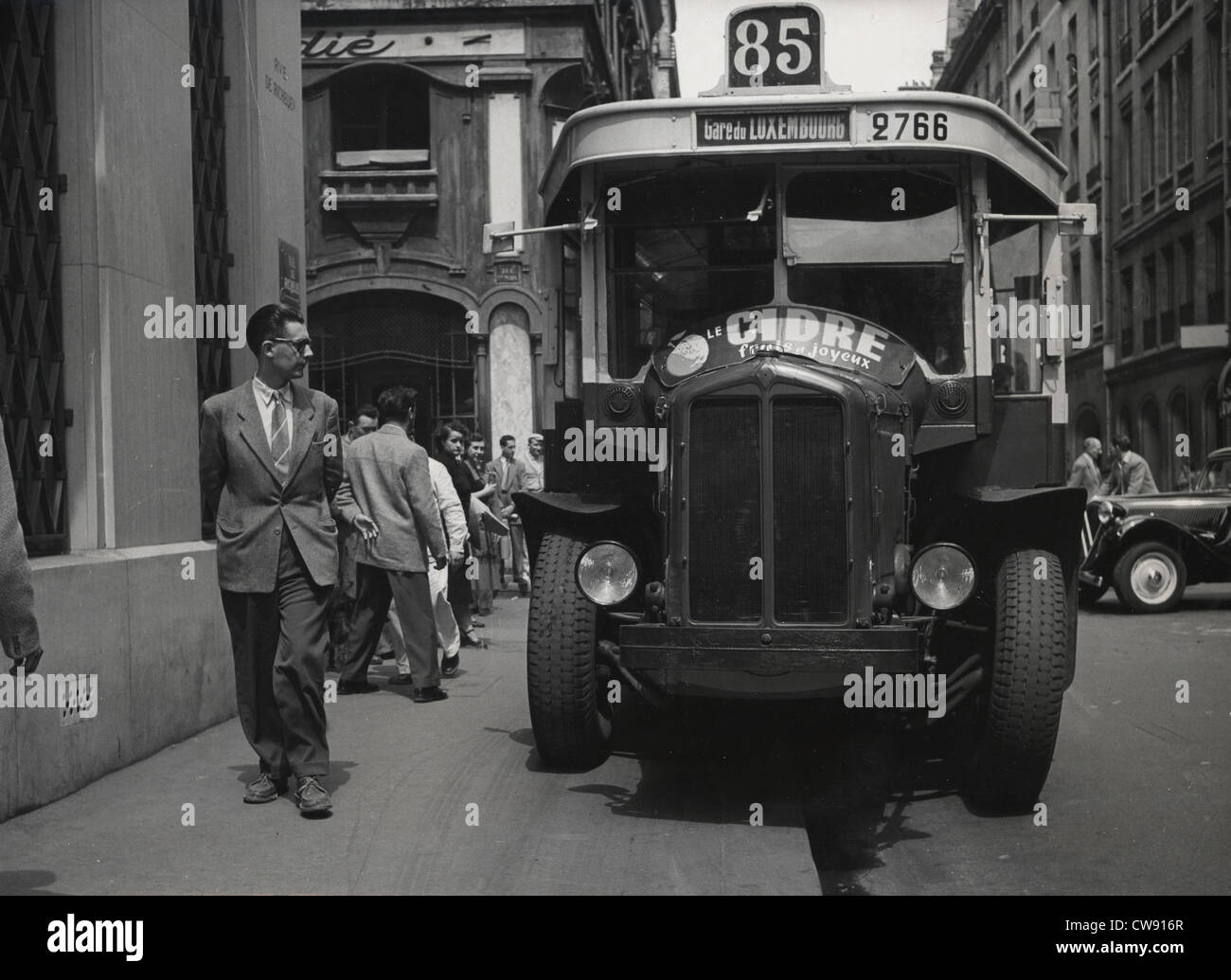 Bus driving on the pavement Stock Photo - Alamy