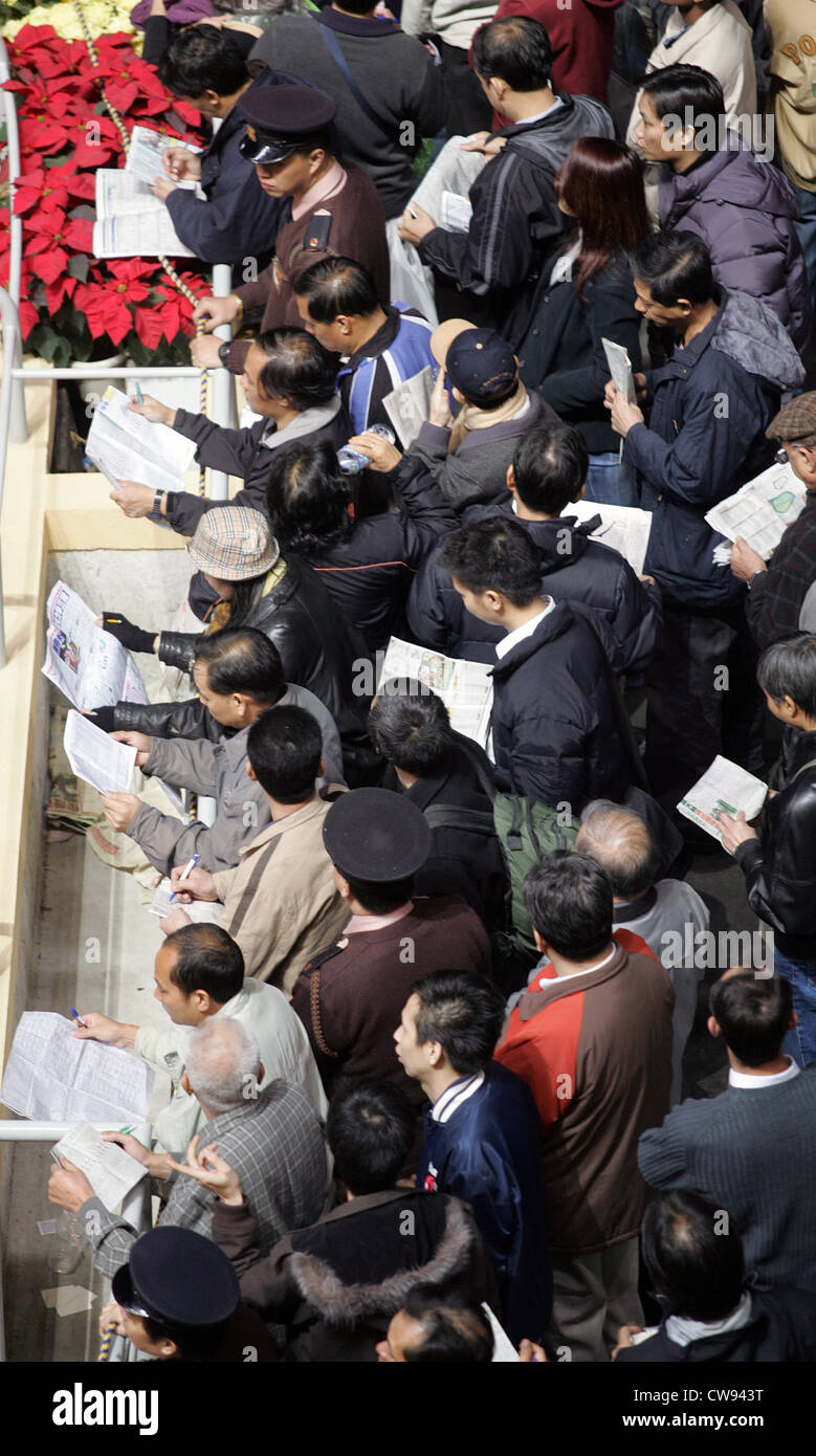Hong Kong, People standing on a tribune Stock Photo - Alamy