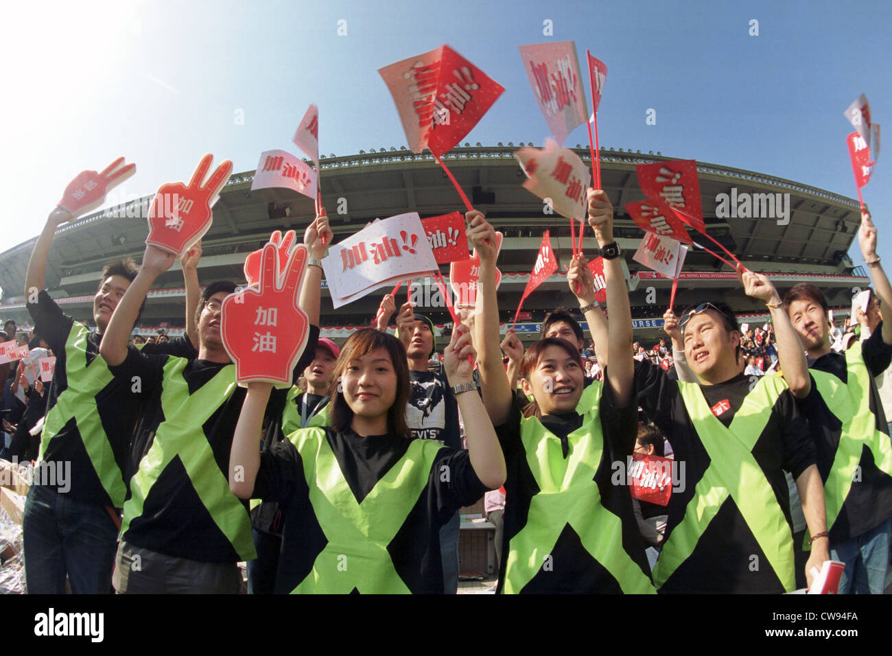 Hong Kong, people waving flags Stock Photo - Alamy