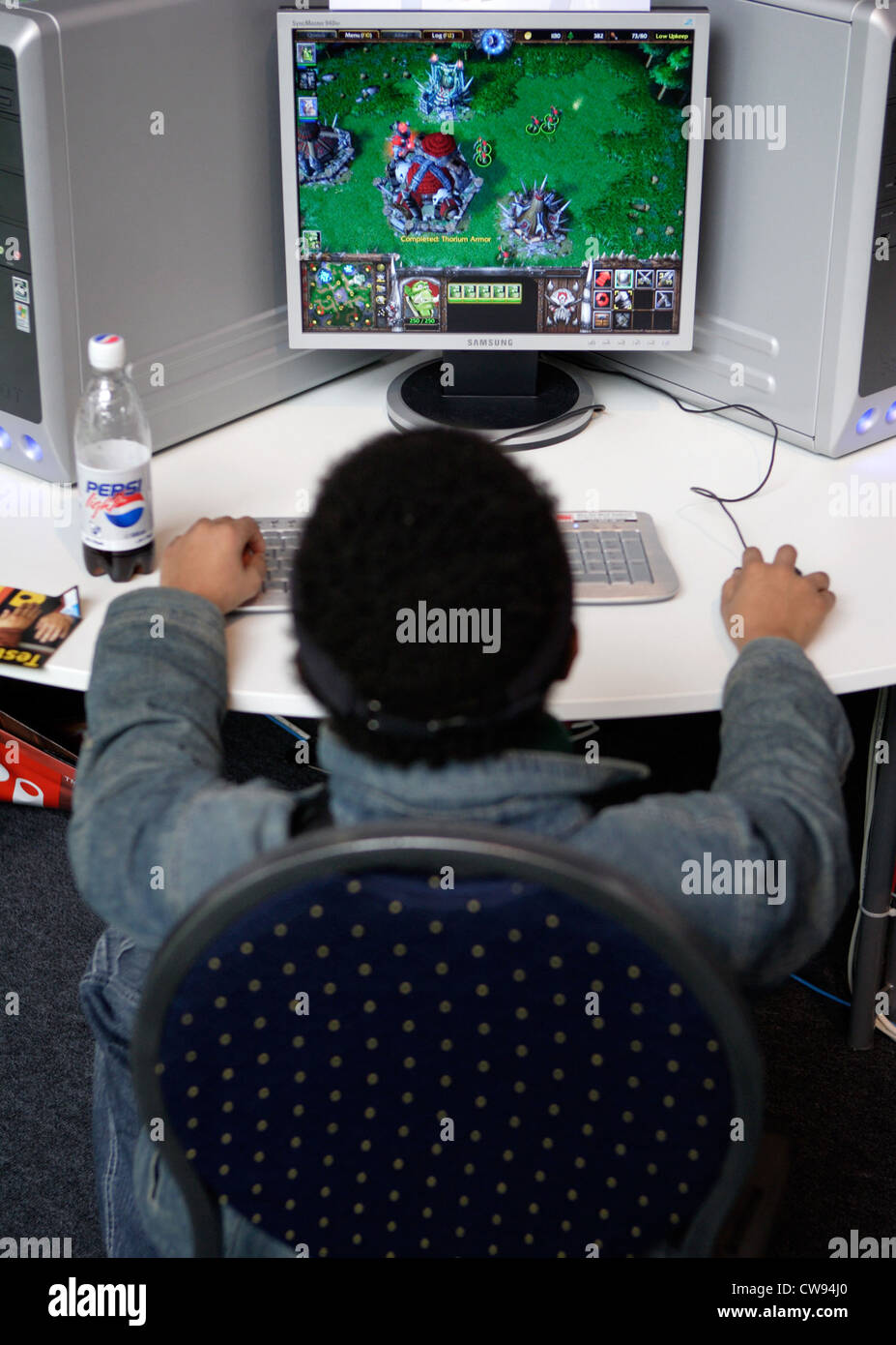 Youth playing on the computer Stock Photo - Alamy