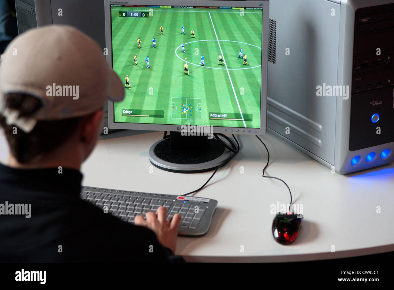 Youth playing on the computer Stock Photo - Alamy