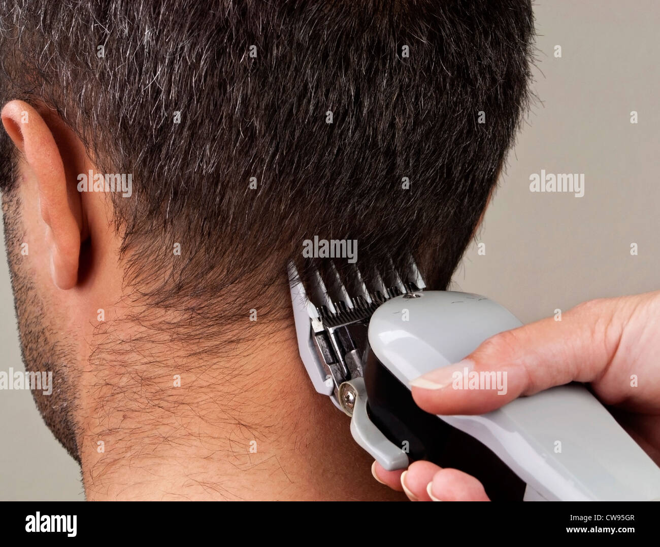 Man getting a haircut by a hairdresser Stock Photo - Alamy