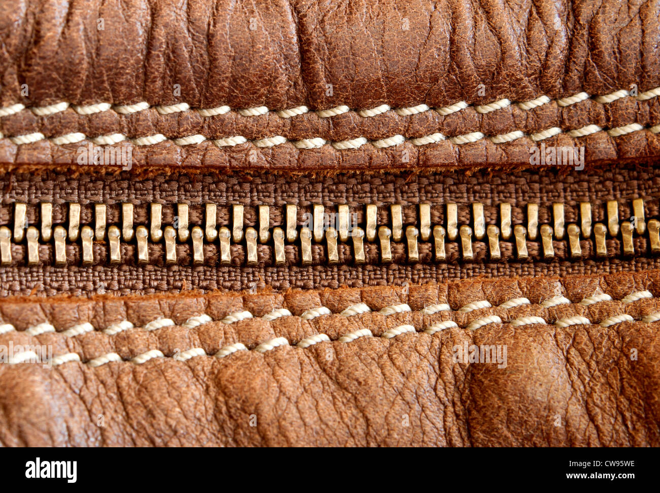 Close up of zipper and leather stitch detail Stock Photo - Alamy
