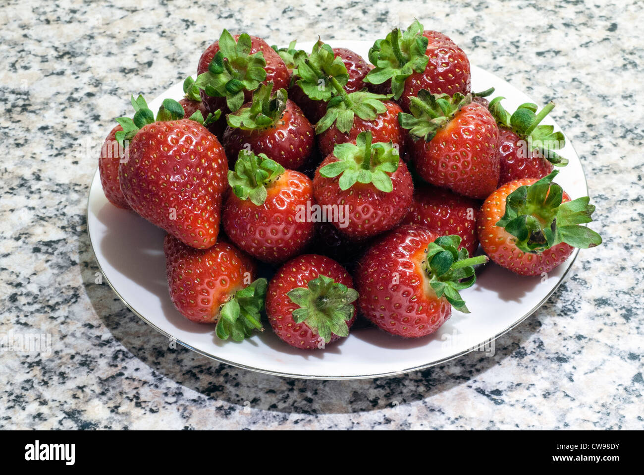 Colourful display of strawberries hi-res stock photography and images ...