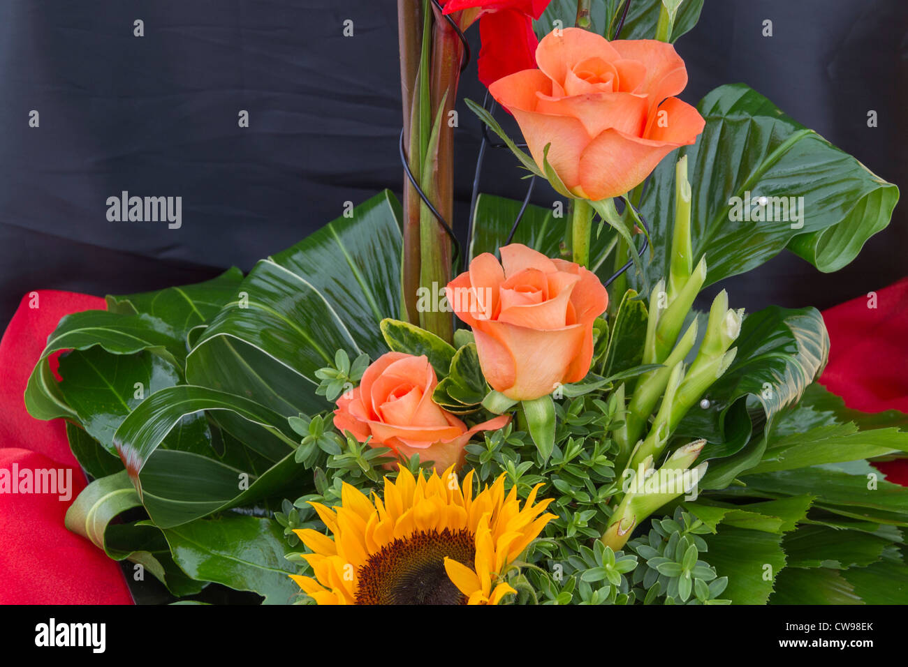 Colorful flower arrangement with pink roses and sunflower Stock Photo ...