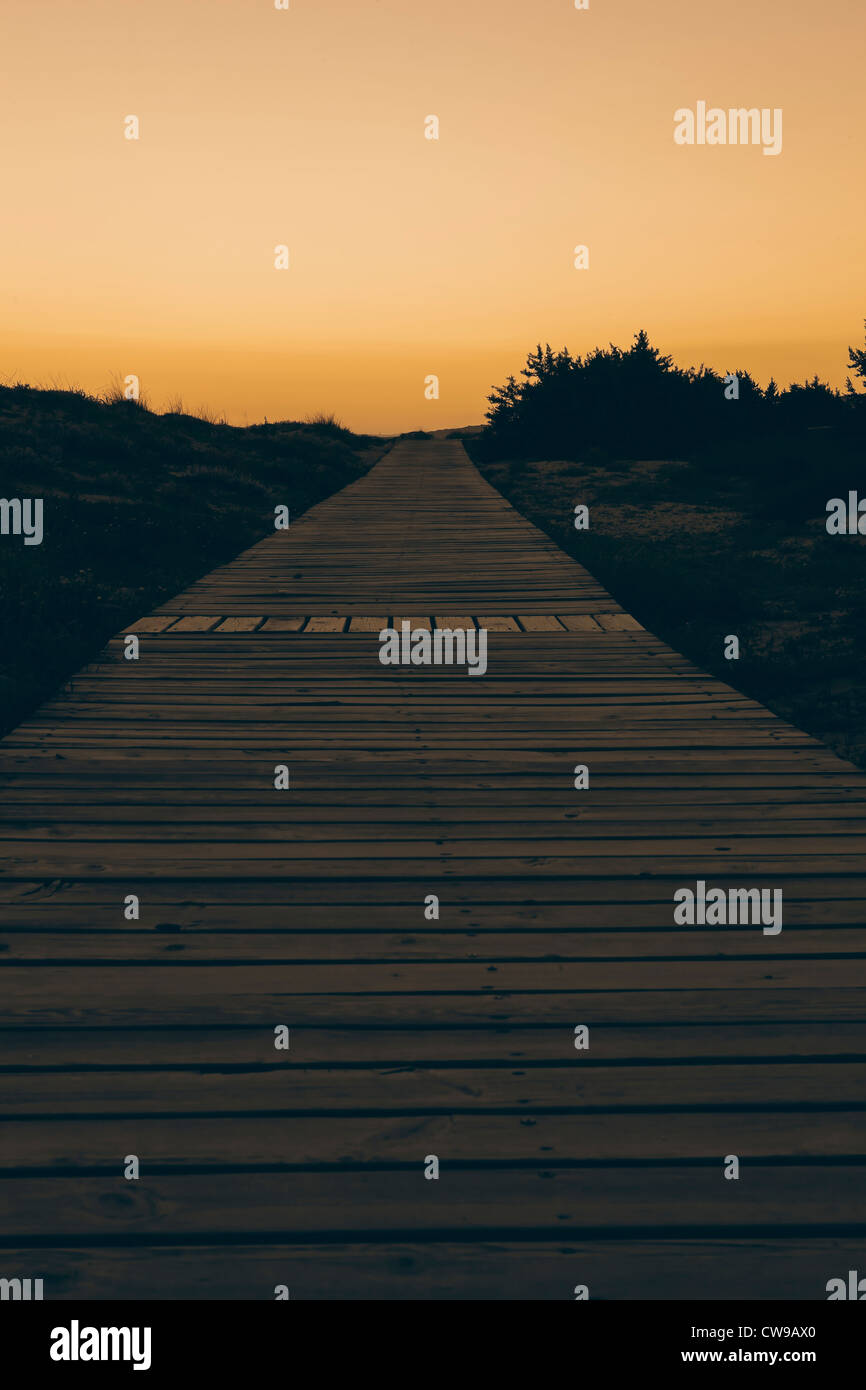 a boardwalk through the dunes at sunset Stock Photo - Alamy