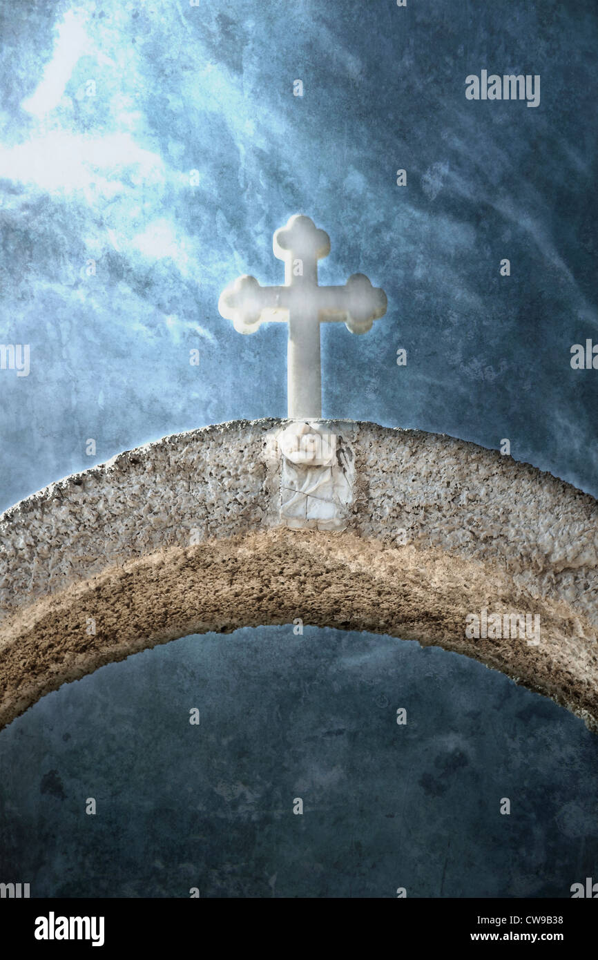 a cross with a rose on a stone arch Stock Photo - Alamy