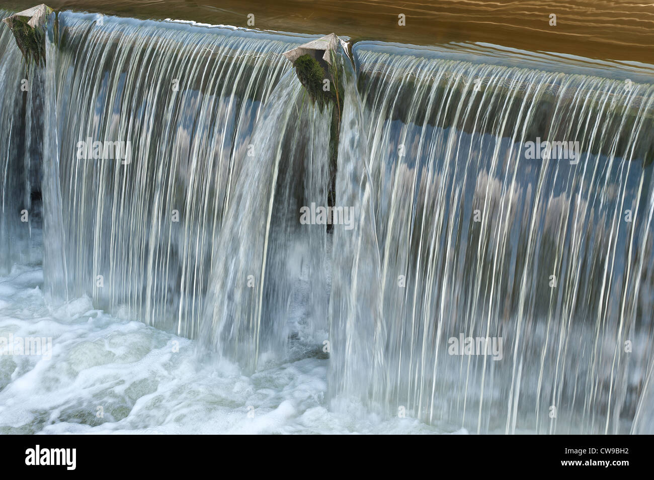Weir flood barrier River Great Ouse close up of water falling as a ...
