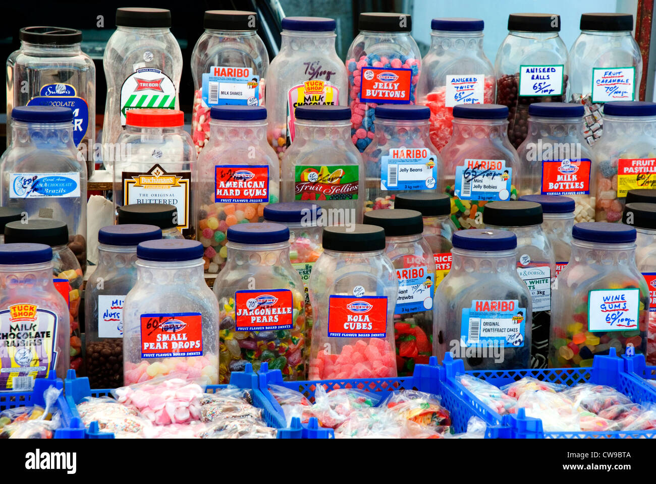 Bottles of sweets on market stall Stock Photo - Alamy