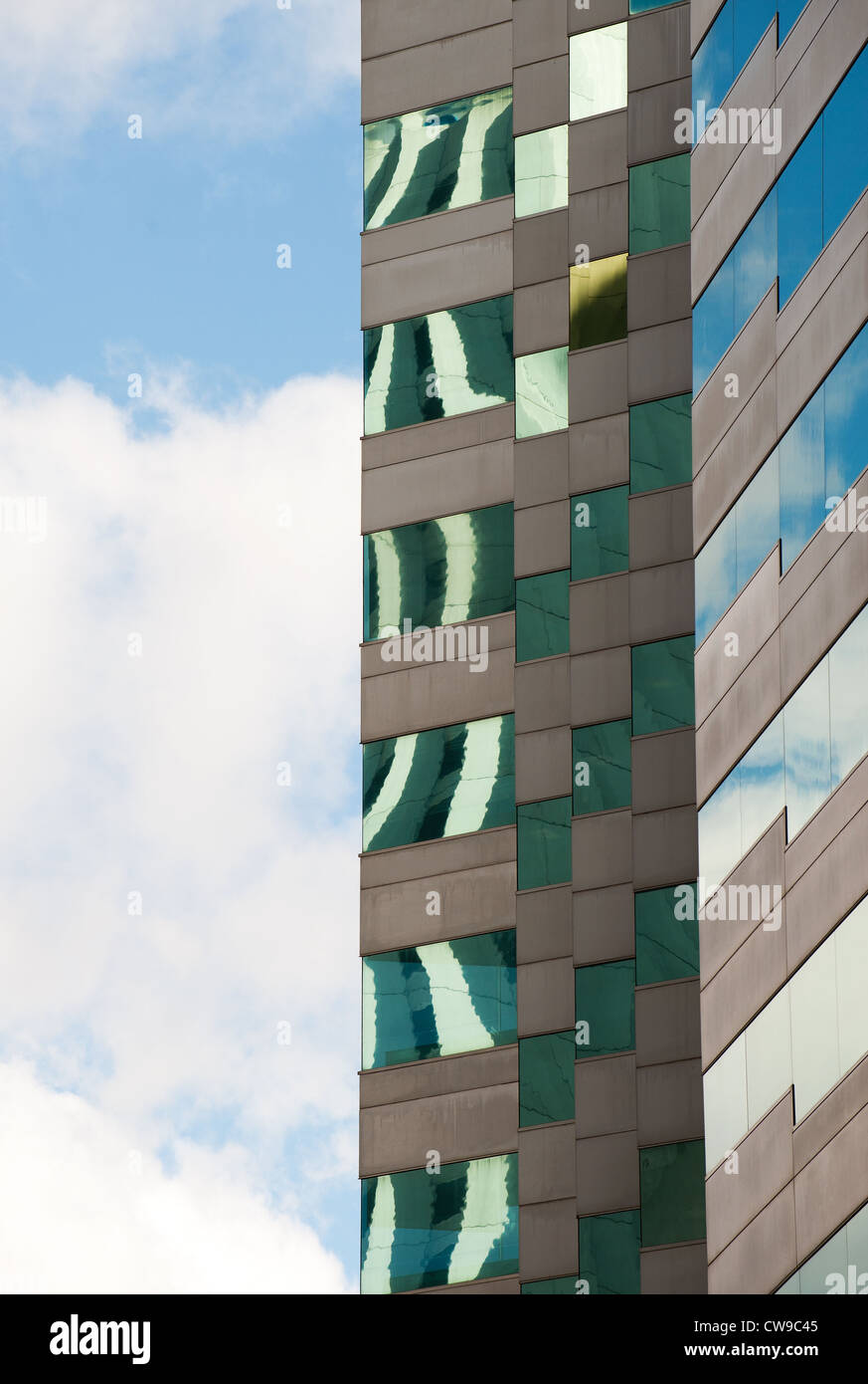 Reflections in the glass windows of a high rise office block in Perth ...