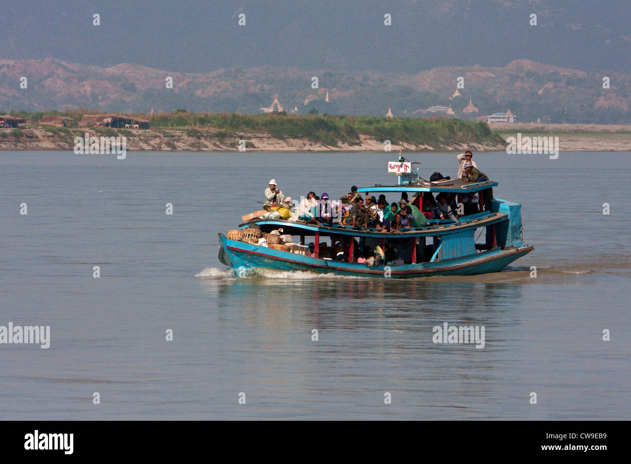 Myanmar, Burma. Boat on the Ayeyarwady River Carrying People and Cargo ...