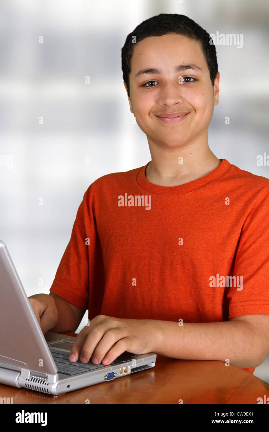 Teen boy doing homework after school at the table Stock Photo - Alamy
