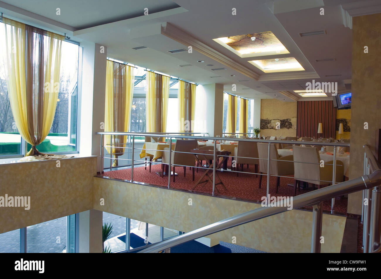 interior of the restaurant in the hotel with several tables Stock Photo ...