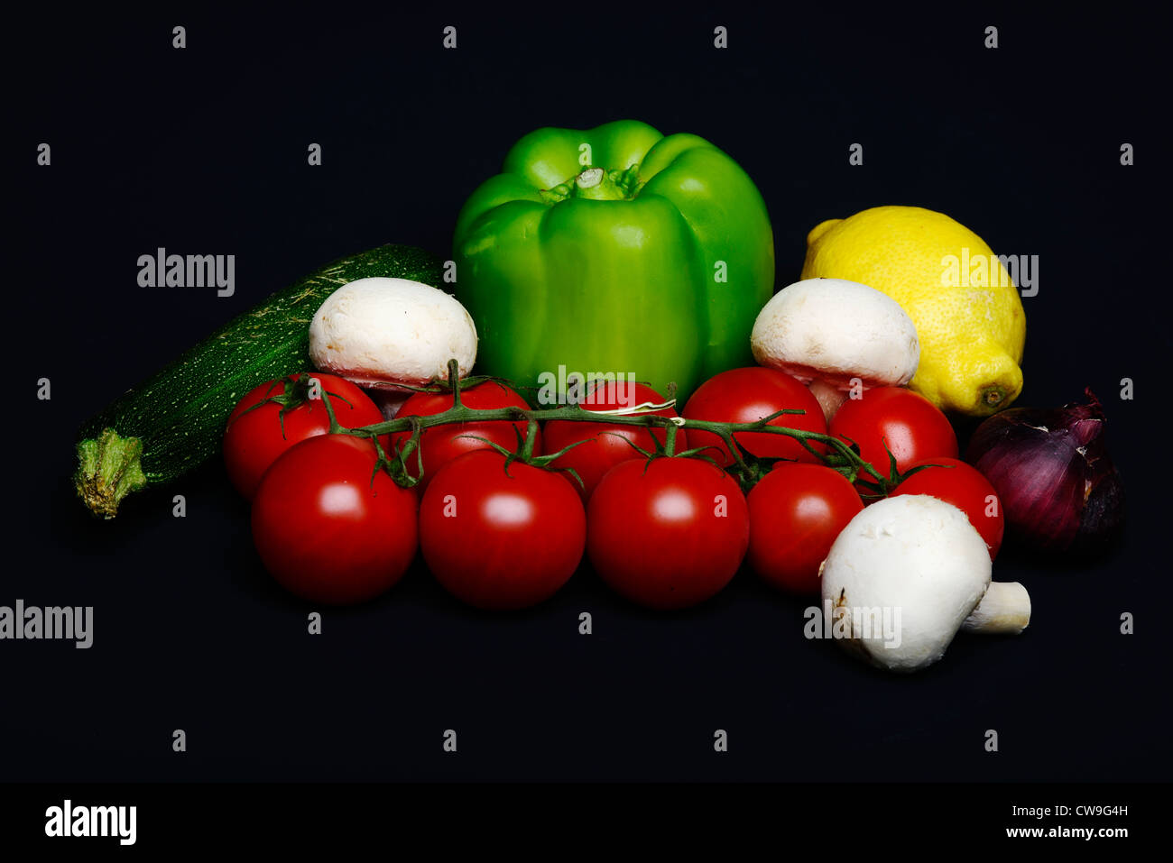 Vegetables on black background Stock Photo - Alamy
