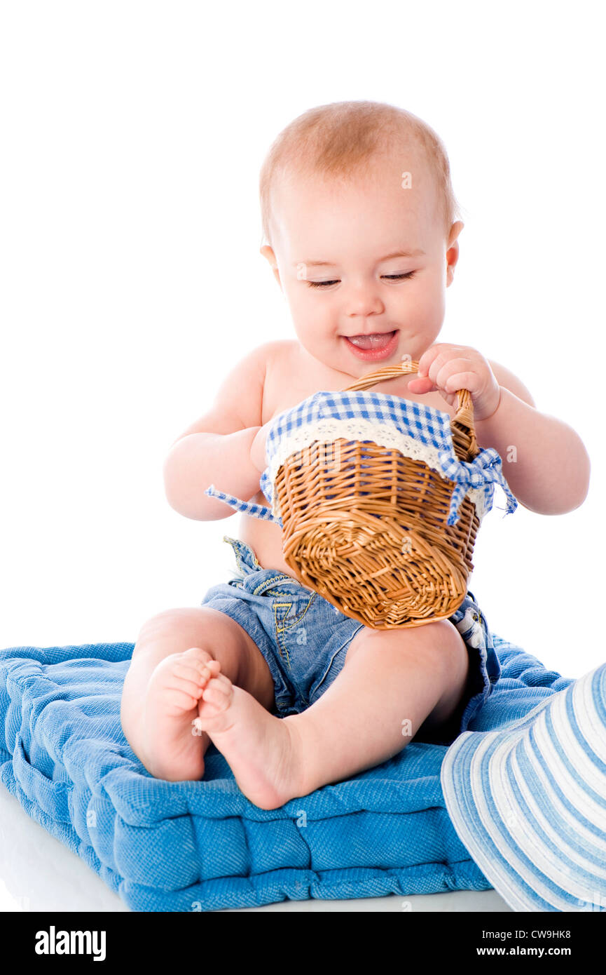 Baby with basket Stock Photo - Alamy