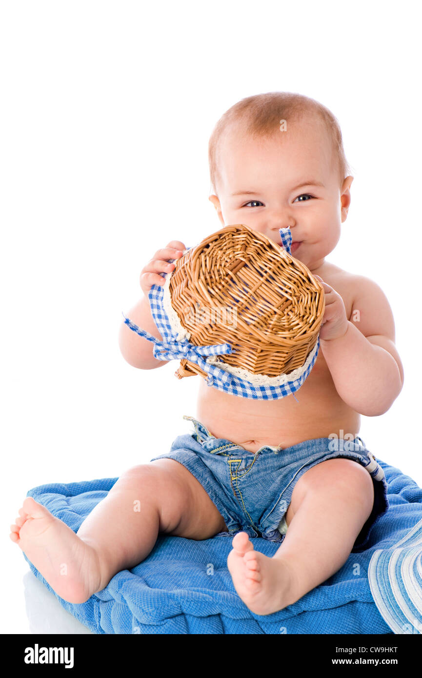 Baby with basket Stock Photo - Alamy