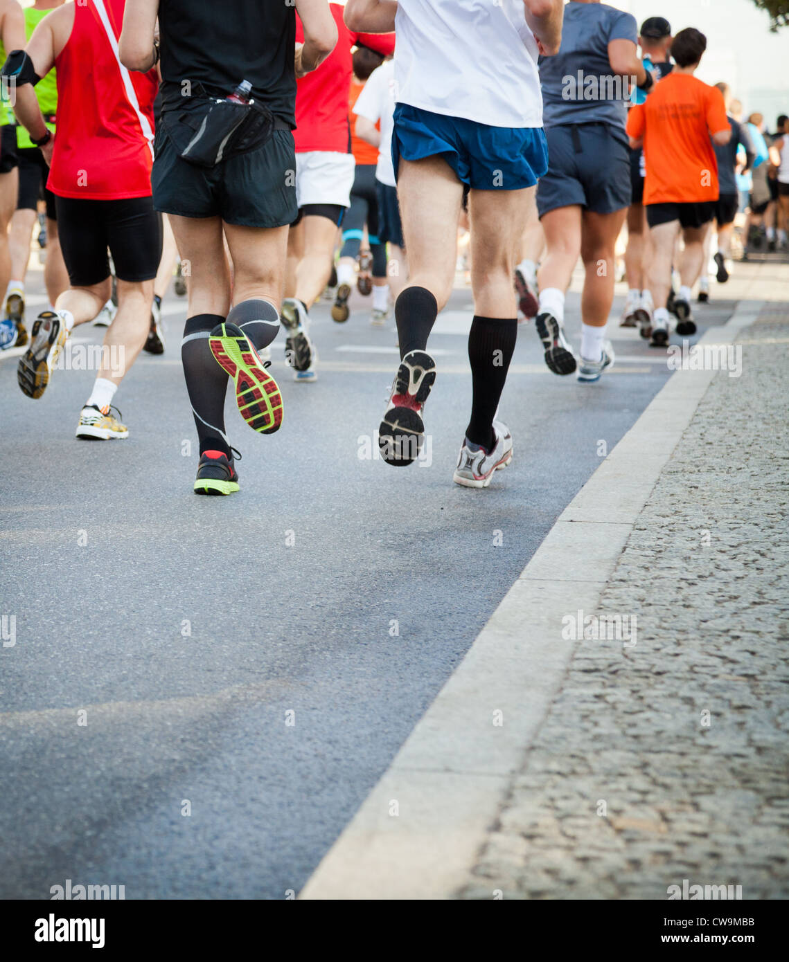 People running fast in a city marathon on street Stock Photo - Alamy
