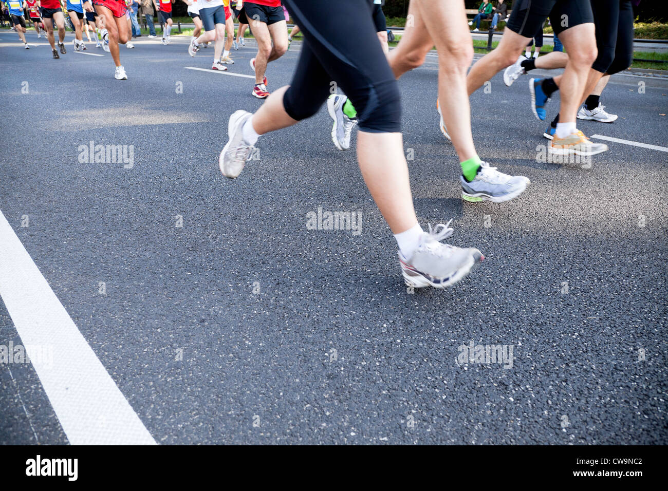 People running fast in a city marathon on street Stock Photo - Alamy