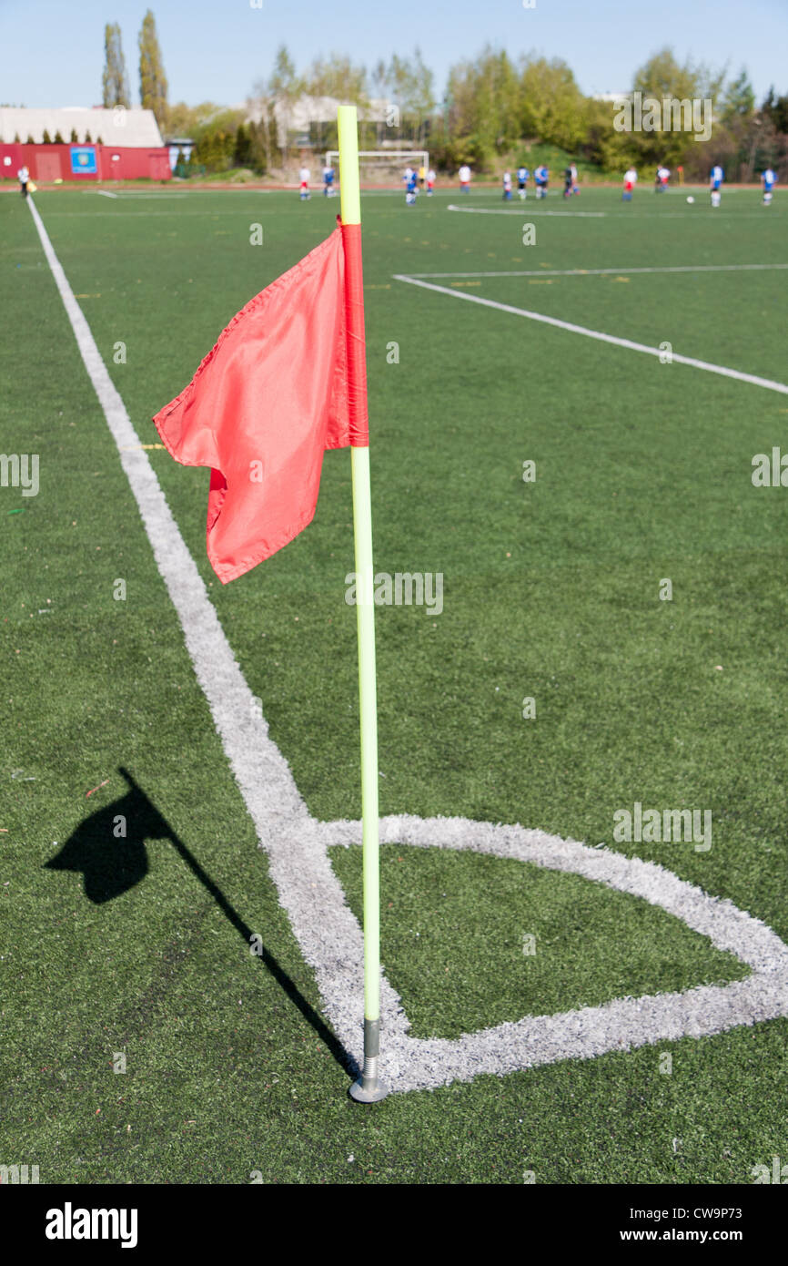 Red flag in corner of soccer field in summer day Stock Photo - Alamy