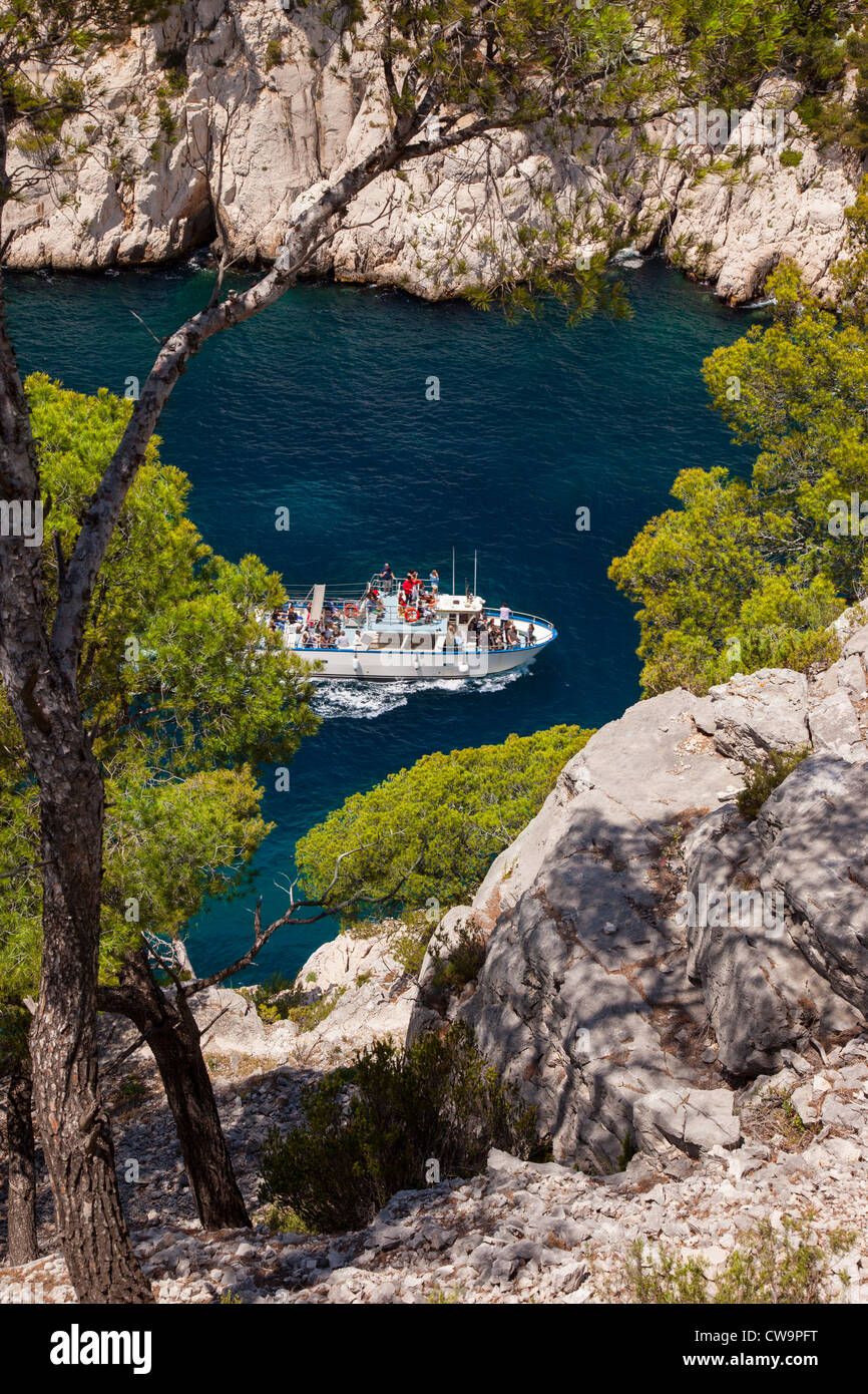 Tour boat in one of the Calanques near Cassis, Bouches-du-Rhone, Cote d ...
