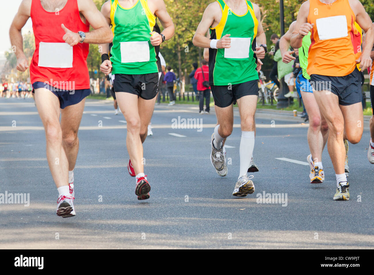 People running fast in a city marathon on street Stock Photo - Alamy