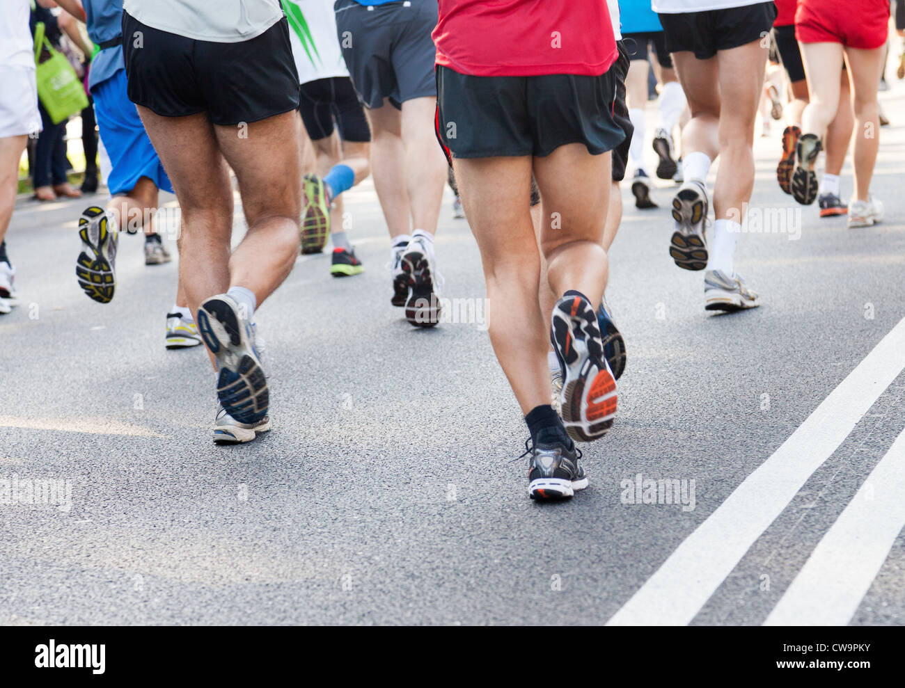 People running fast in a city marathon on street Stock Photo - Alamy