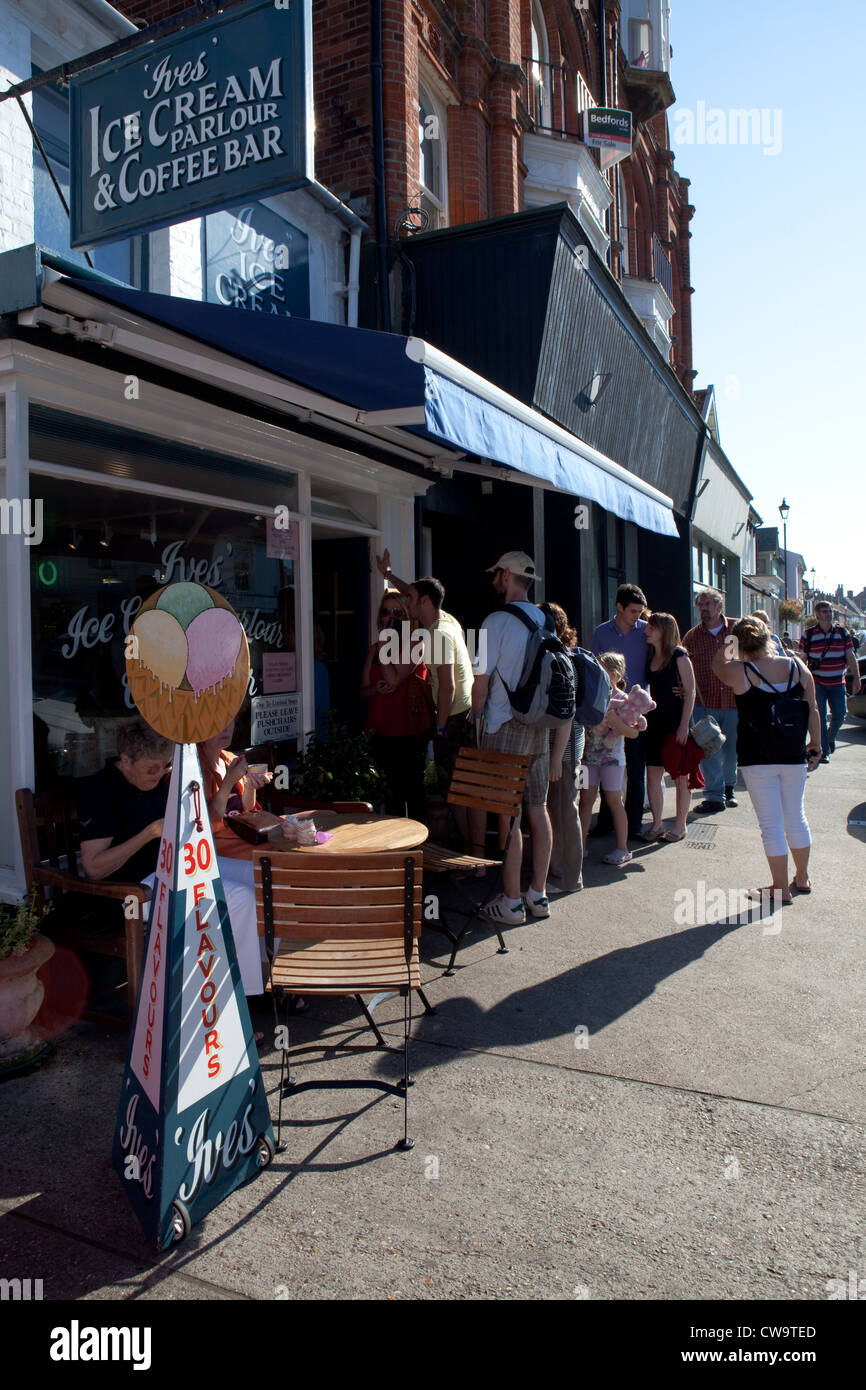 A long queue outside the ice cream shop on Aldeburgh High St in Suffolk ...