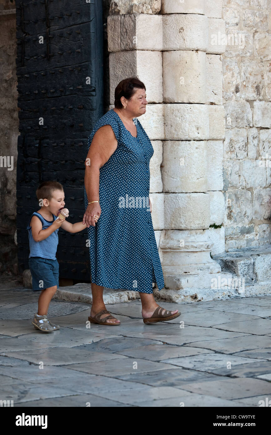 Grandma and grandson walking, Trogir, Dalmatia, Croatia Stock Photo - Alamy