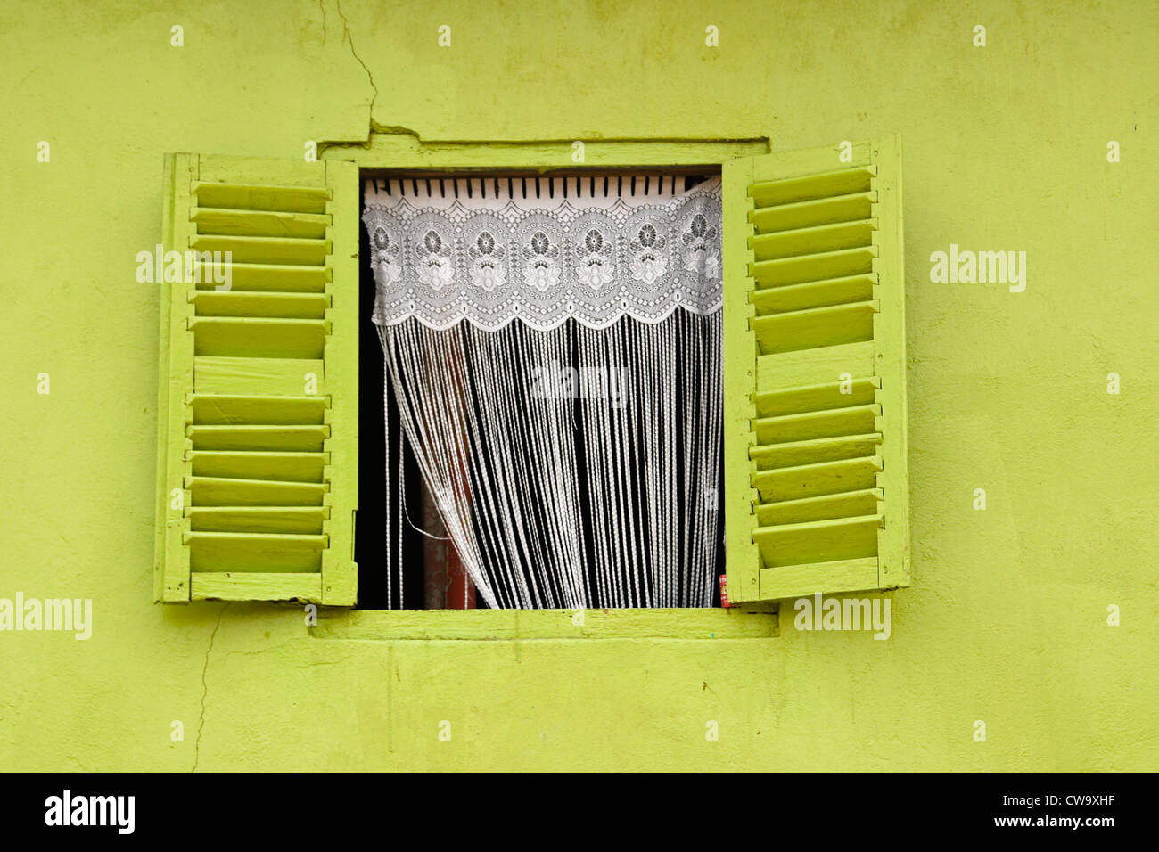 Lace curtains in window of colorful house, Axim, Ghana Stock Photo - Alamy