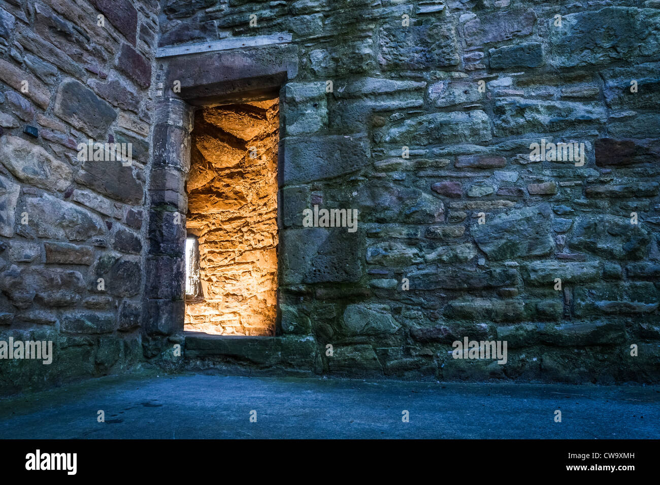 Lighted dorway to the ancient castle Stock Photo - Alamy