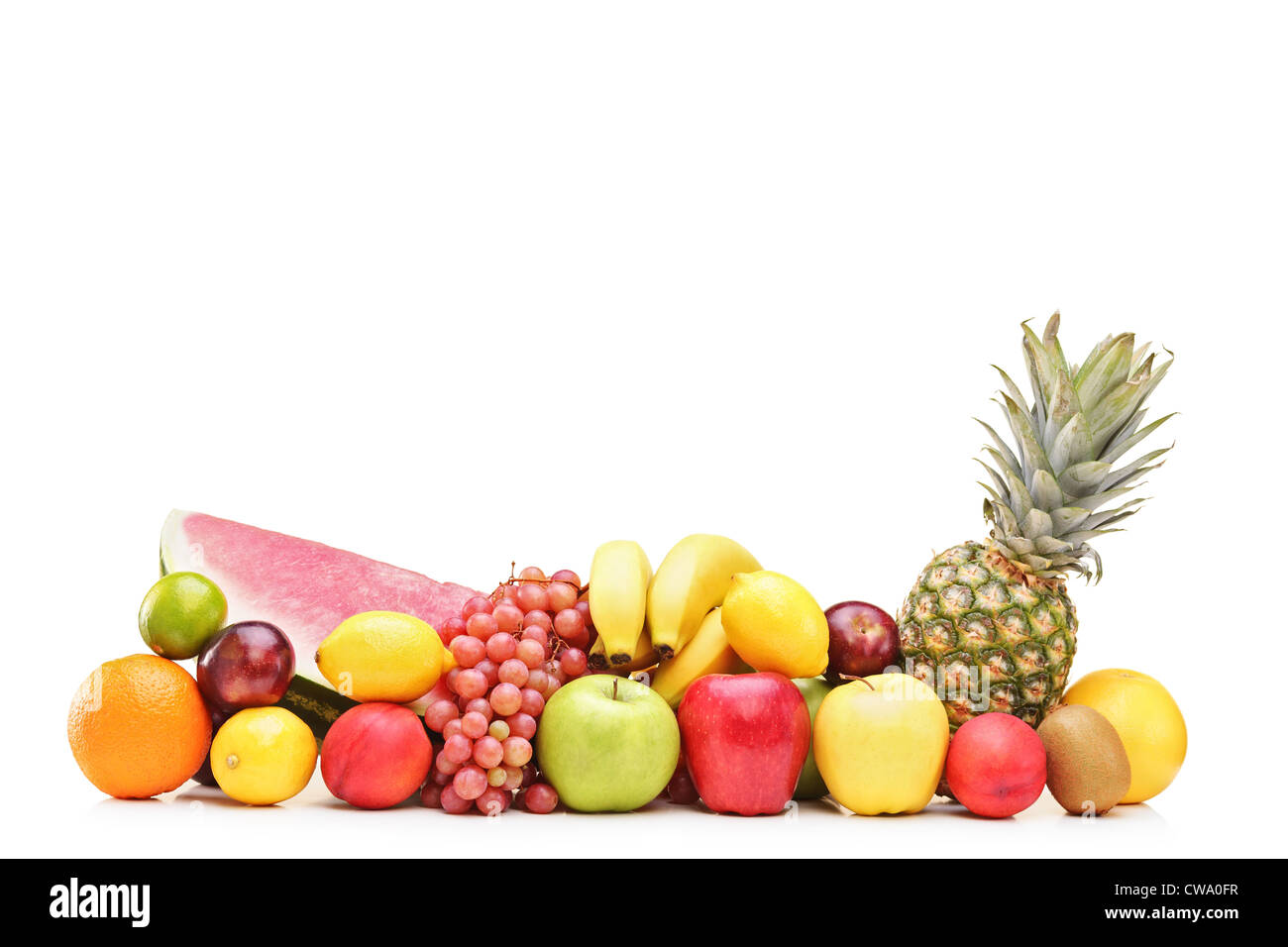 Pile of fruits on a table isolated on white background Stock Photo - Alamy