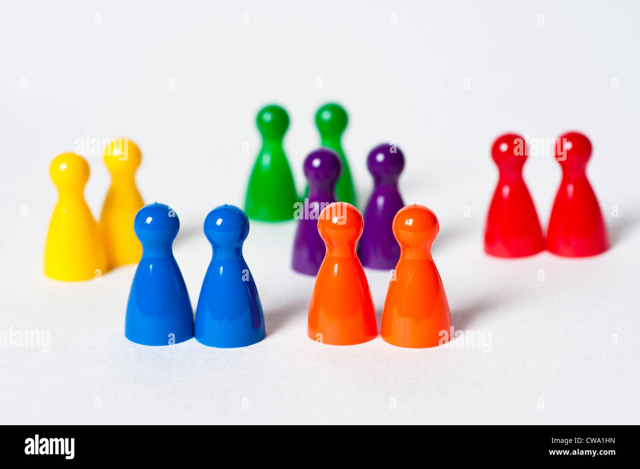 Colourful pawns in pairs Stock Photo - Alamy