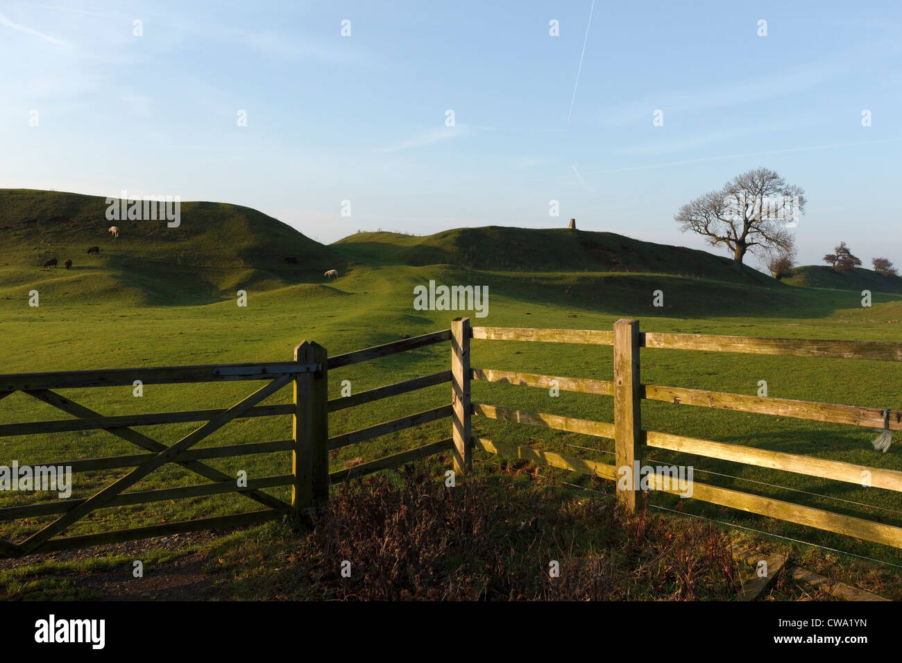 Gateway, fencing and earthwork ramparts by entrance to the Iron Age ...