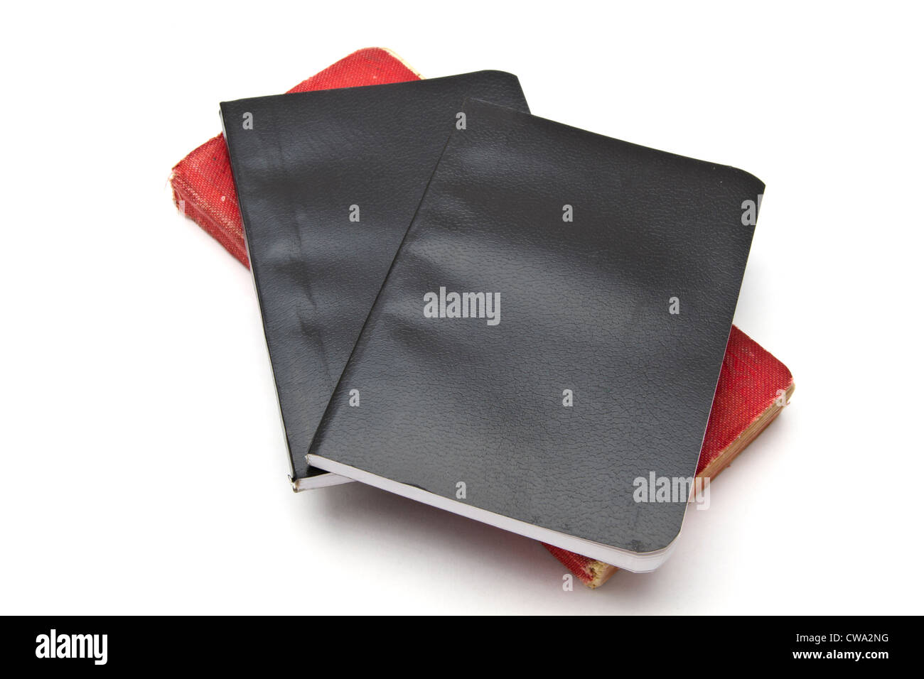 Red and black notebooks closeup on white Stock Photo - Alamy