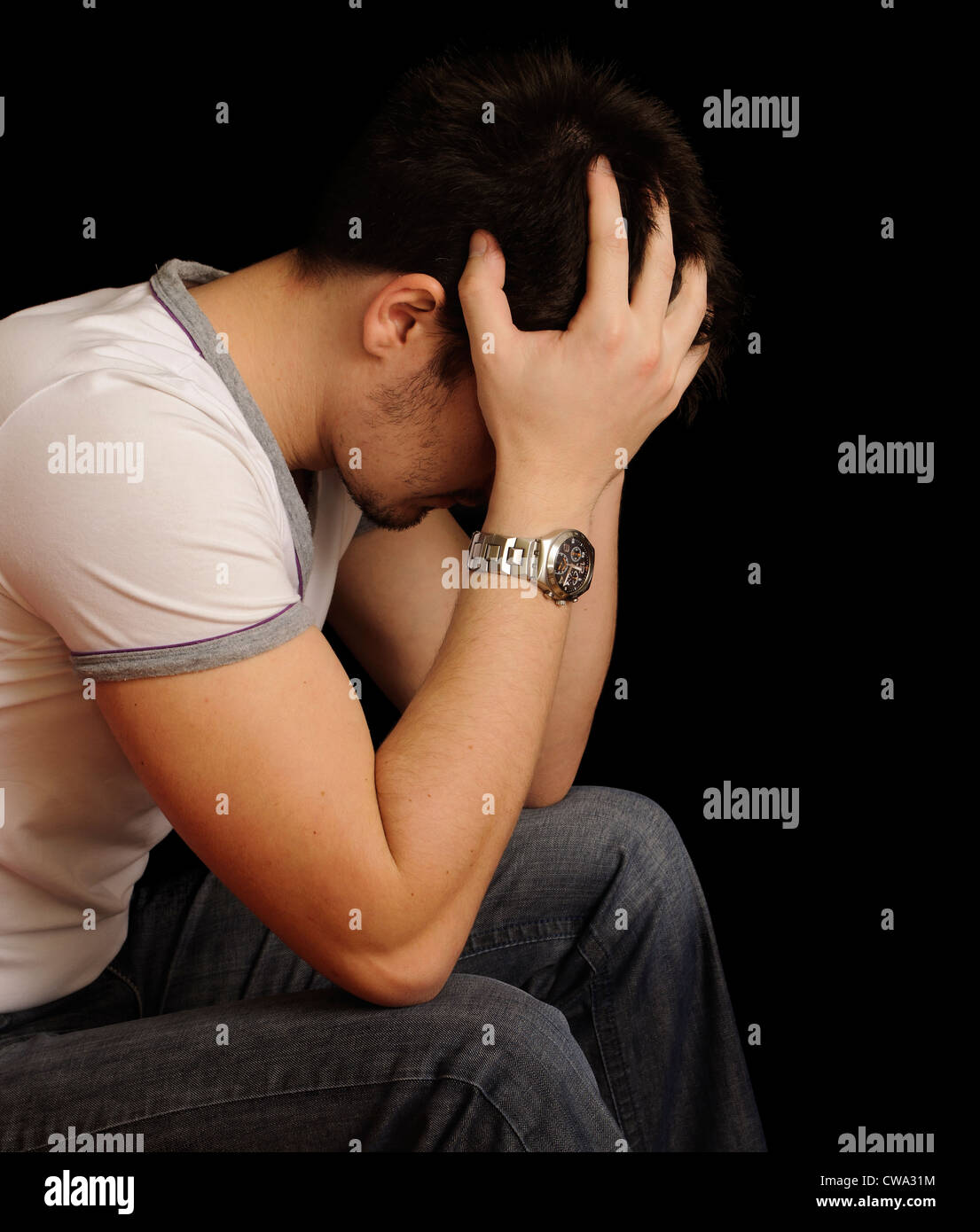 Depressed young man Stock Photo - Alamy