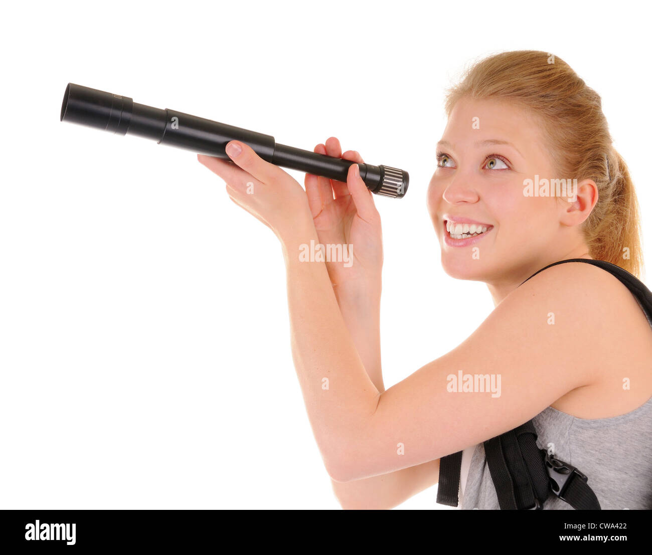 Attractive smiling young woman with telescope on white background Stock ...