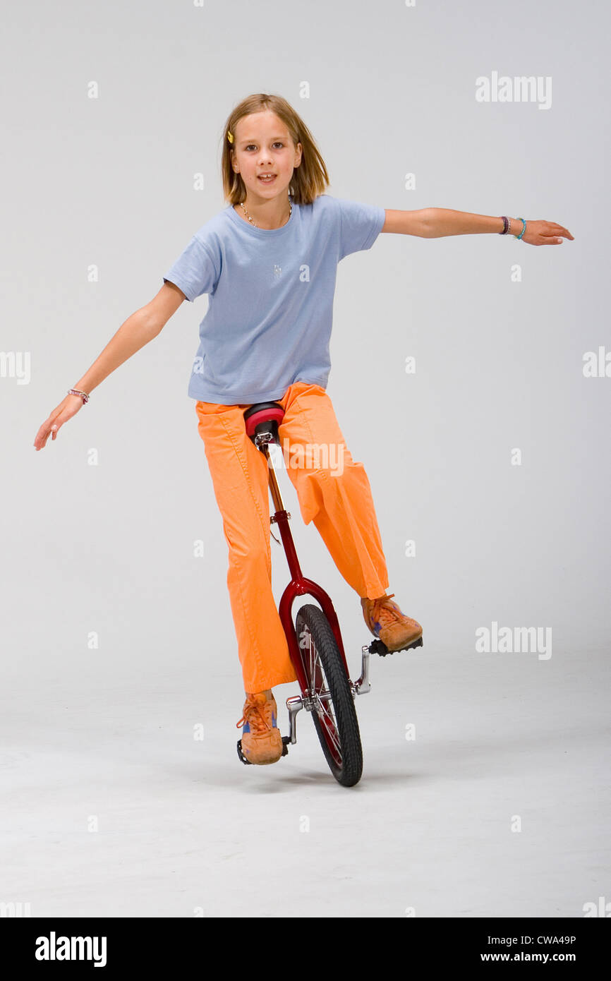 Berlin, girl on a unicycle Stock Photo - Alamy