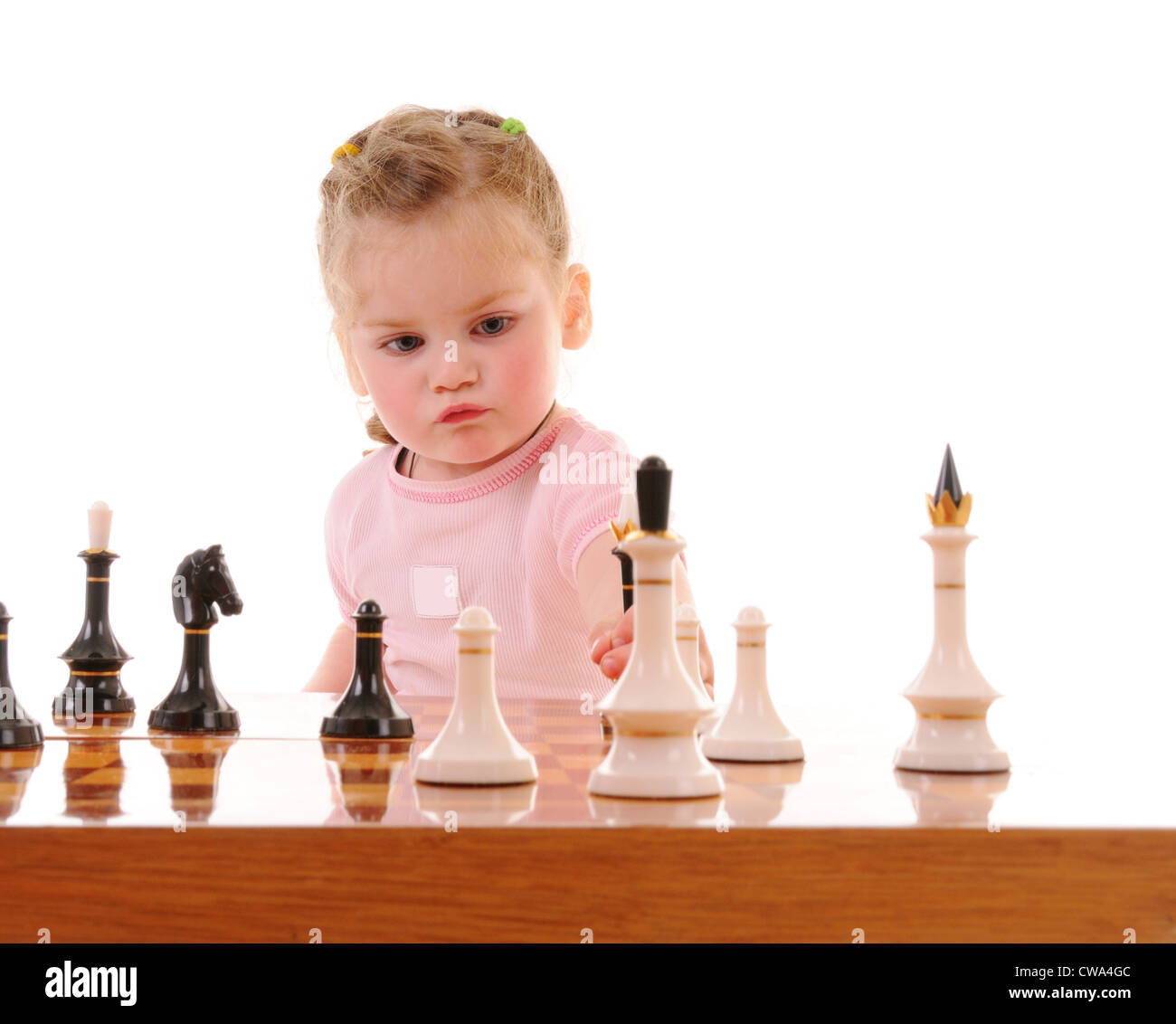 Blonde small girl playing the chess on white background Stock Photo - Alamy