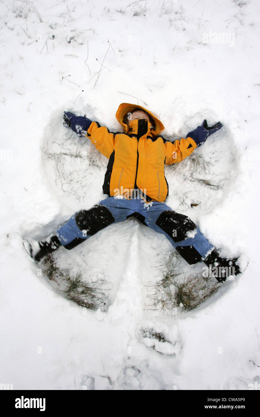 Boy making a snow angel hi-res stock photography and images - Alamy