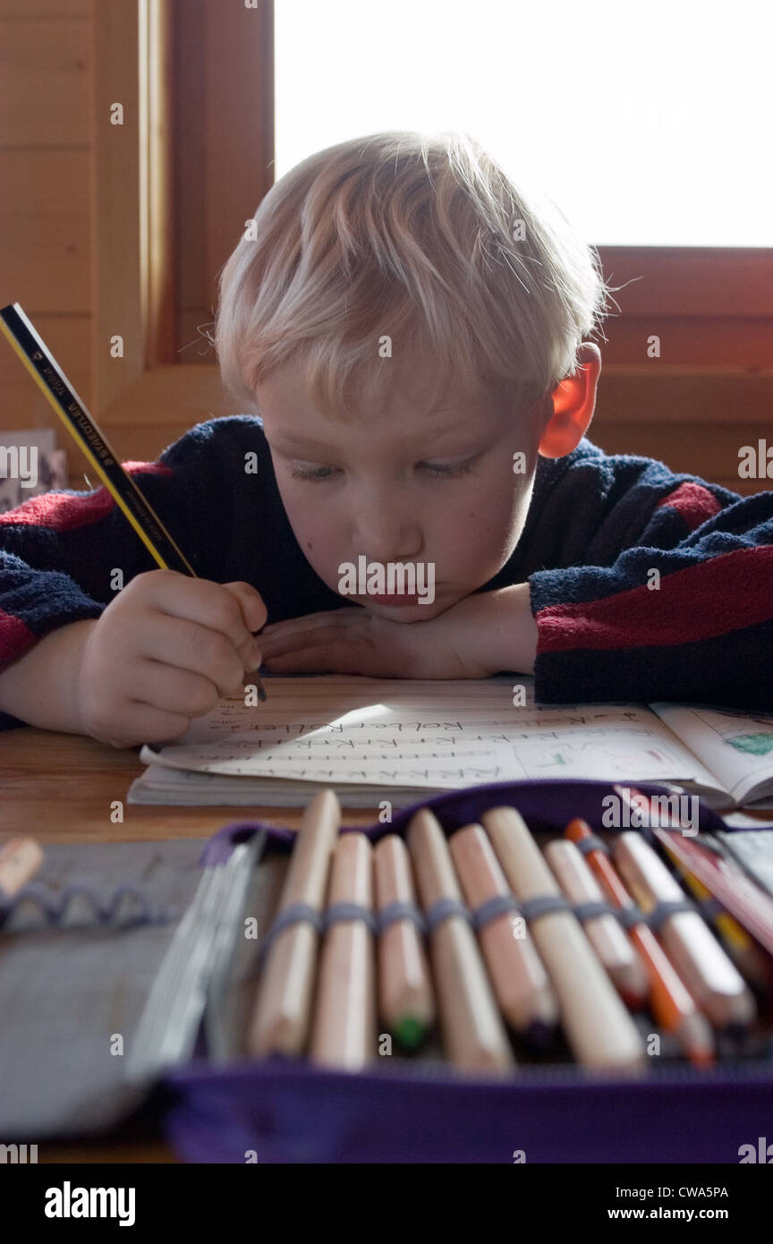 A boy does his homework Stock Photo - Alamy