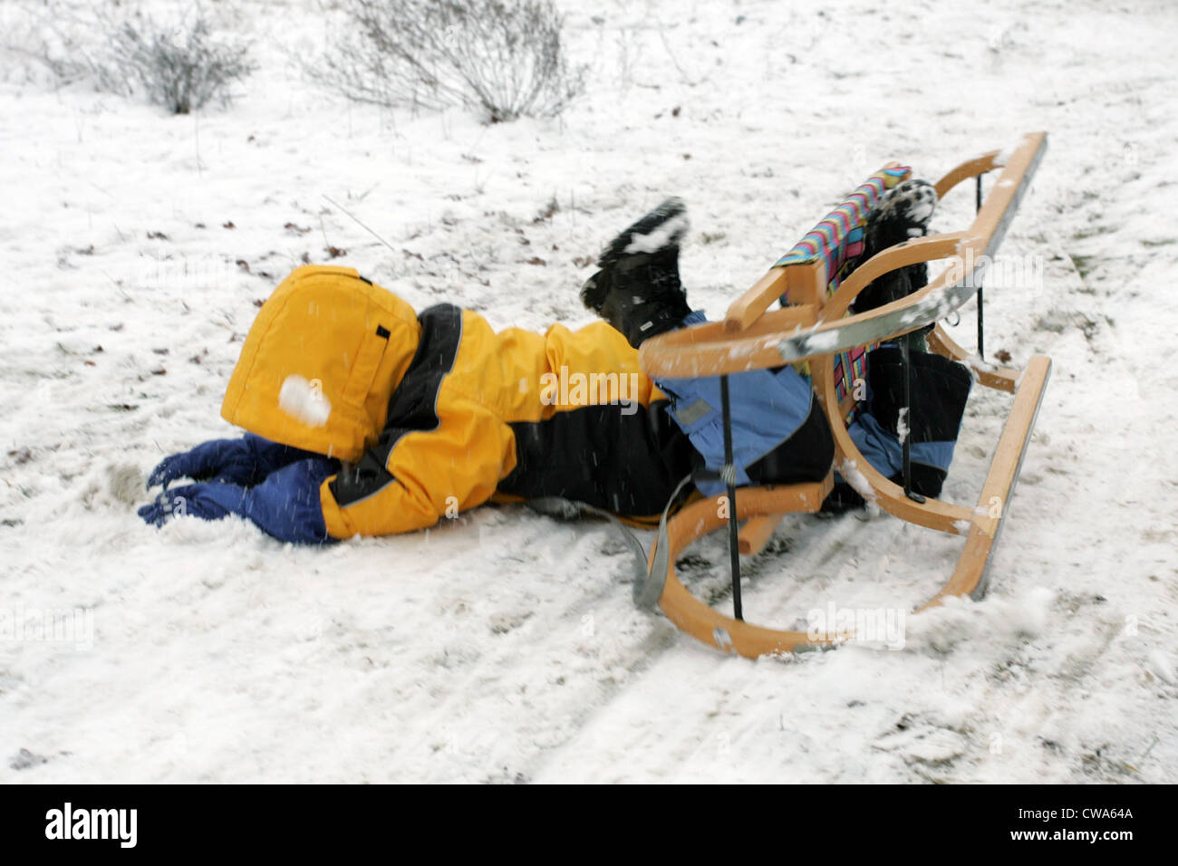 Neuenhagen, a boy fell off his sleigh Stock Photo - Alamy