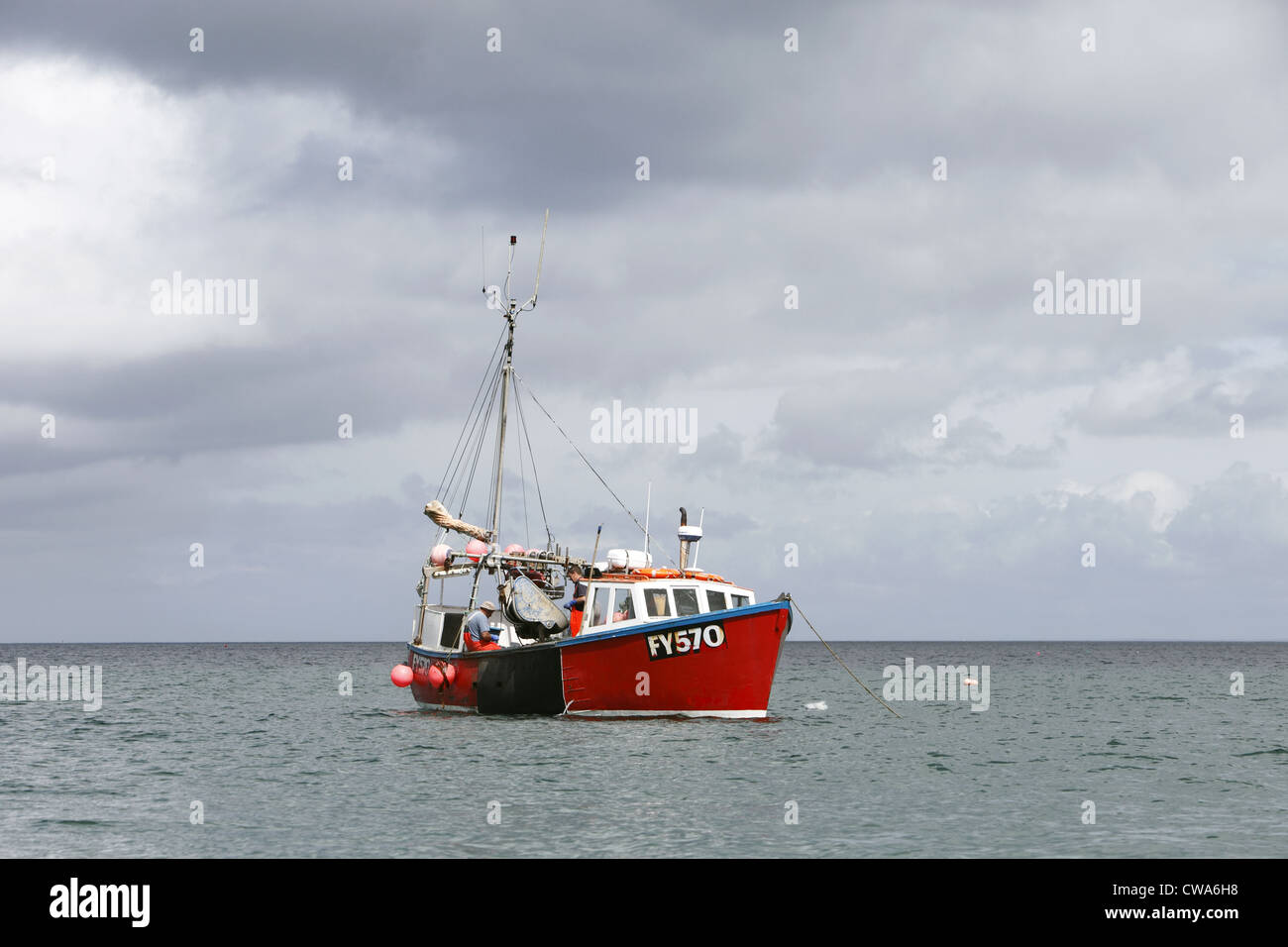 A working fishing trawler outside St. Ives harbour, Cornwall, England ...