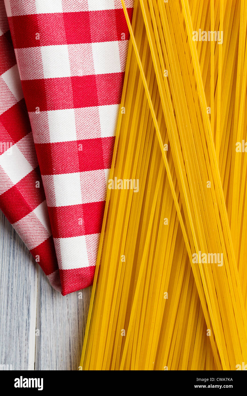 raw spaghetti on kitchen table Stock Photo - Alamy