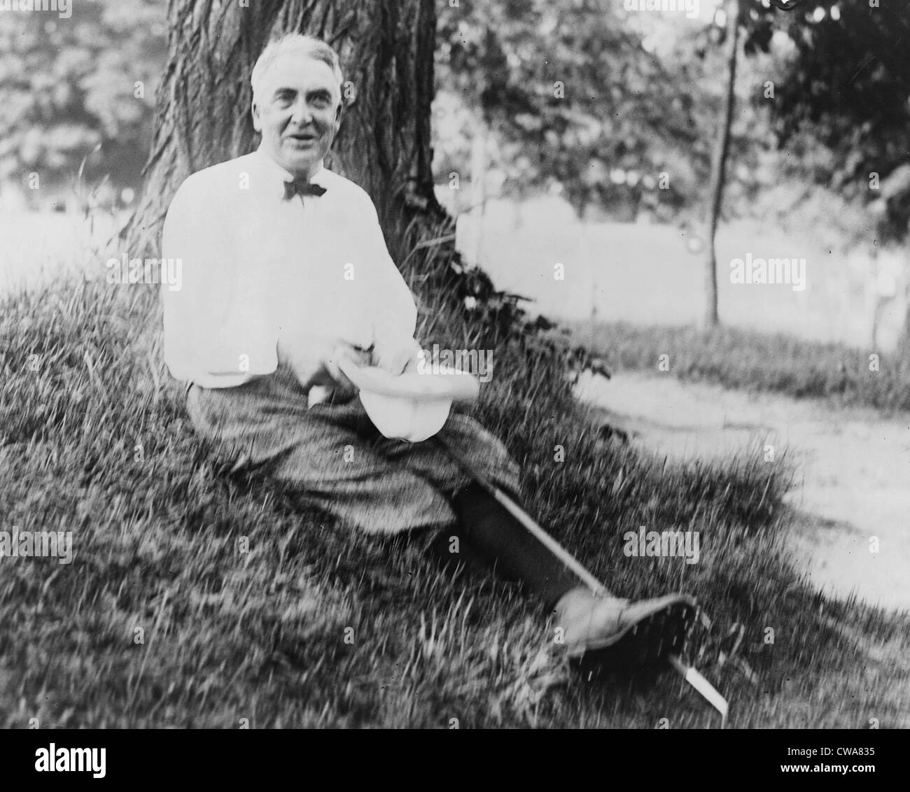 President Warren Harding (1865-1923) wearing golfing clothes, seated on ...